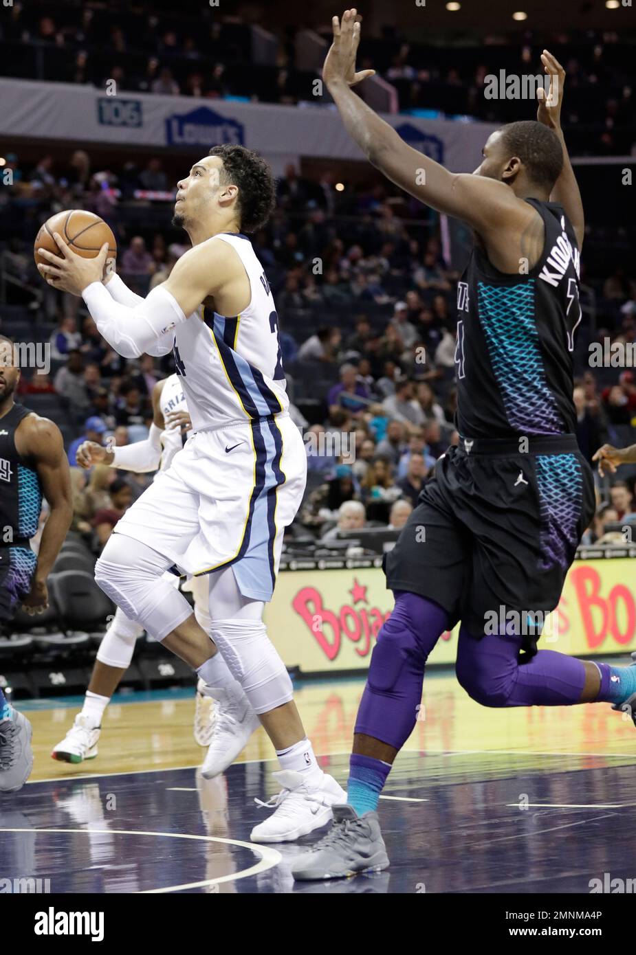 Memphis Grizzlies' Dillon Brooks, left, drives past Charlotte Hornets ...