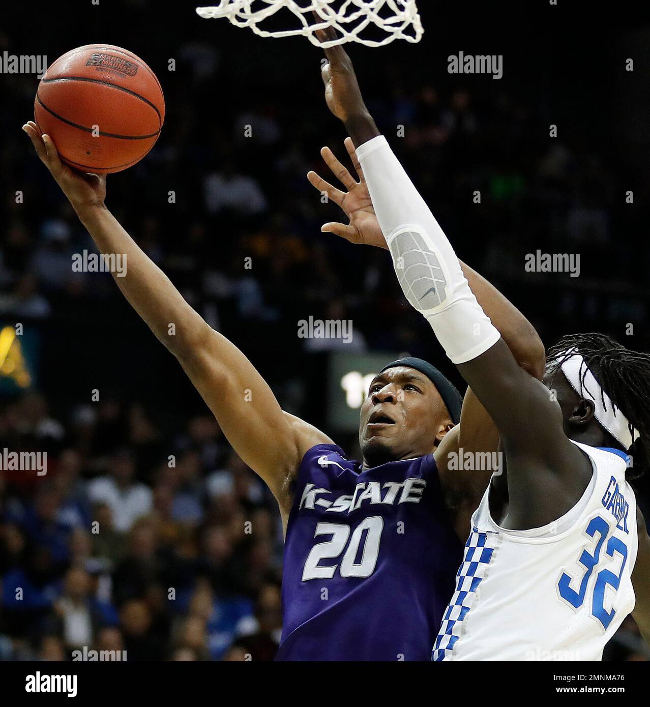 Kansas State forward Xavier Sneed (20) shoots against Kentucky forward ...