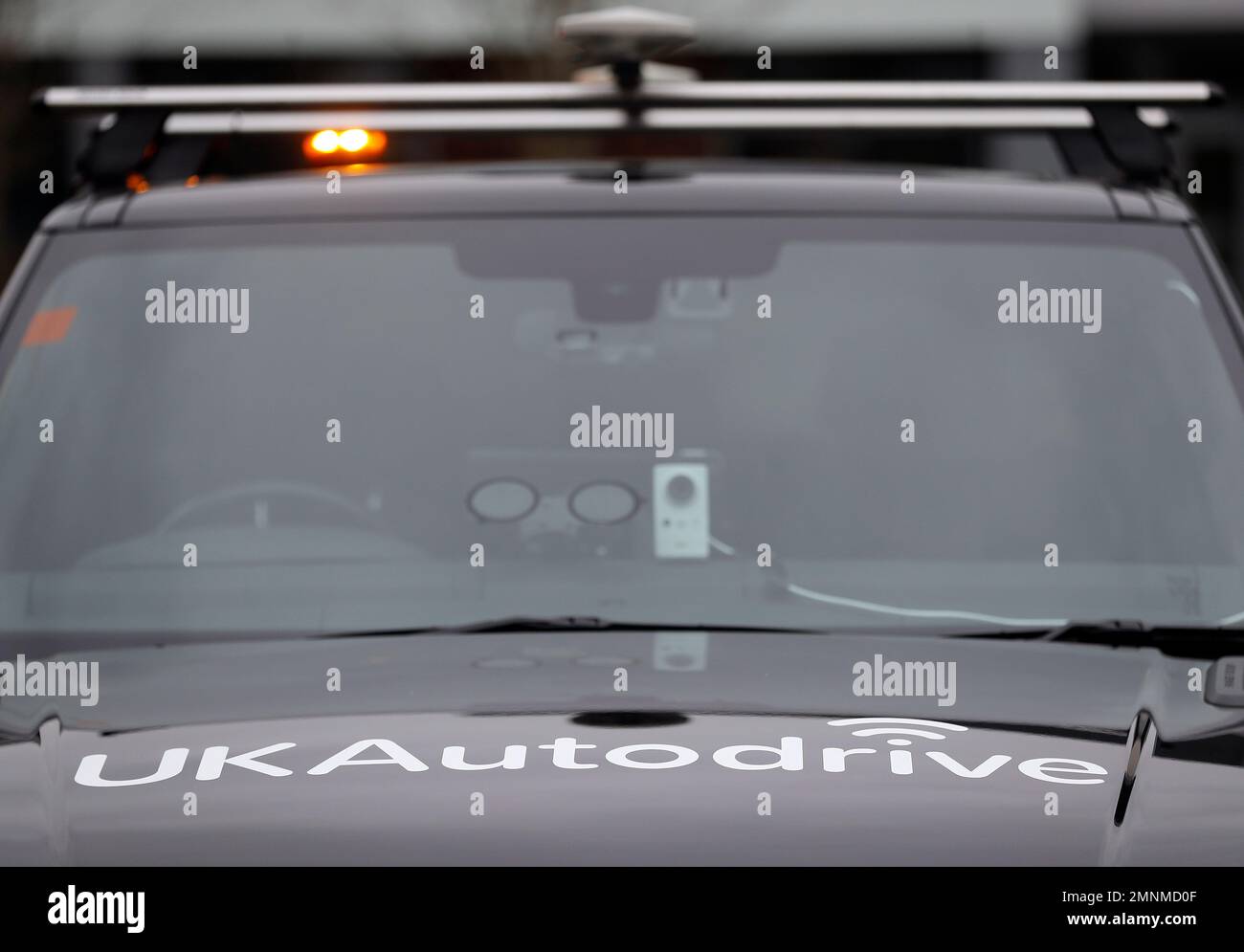A Range Rover self driving with sensors on the windscreen on display ...