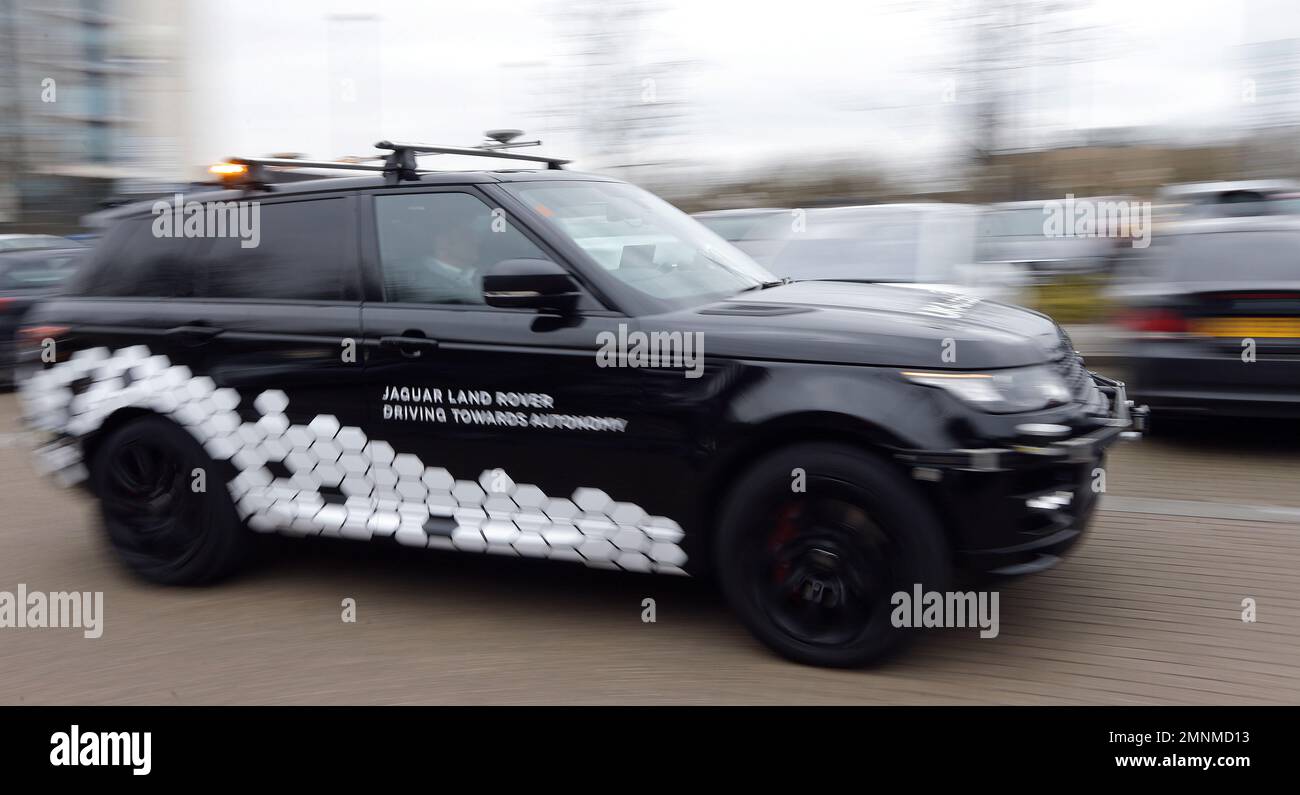A Range Rover self driving car with its sensors drives with a safety ...