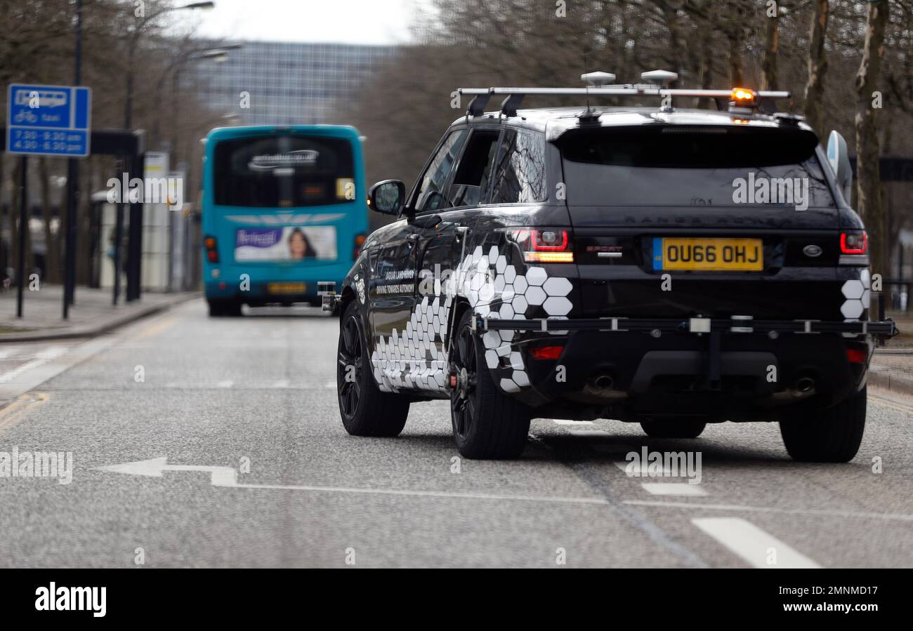 A Range Rover self driving car with its sensors drives with a safety ...