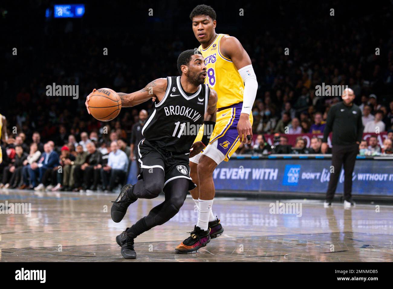 Brooklyn Nets guard Kyrie Irving (11) drives past Los Angeles Lakers ...