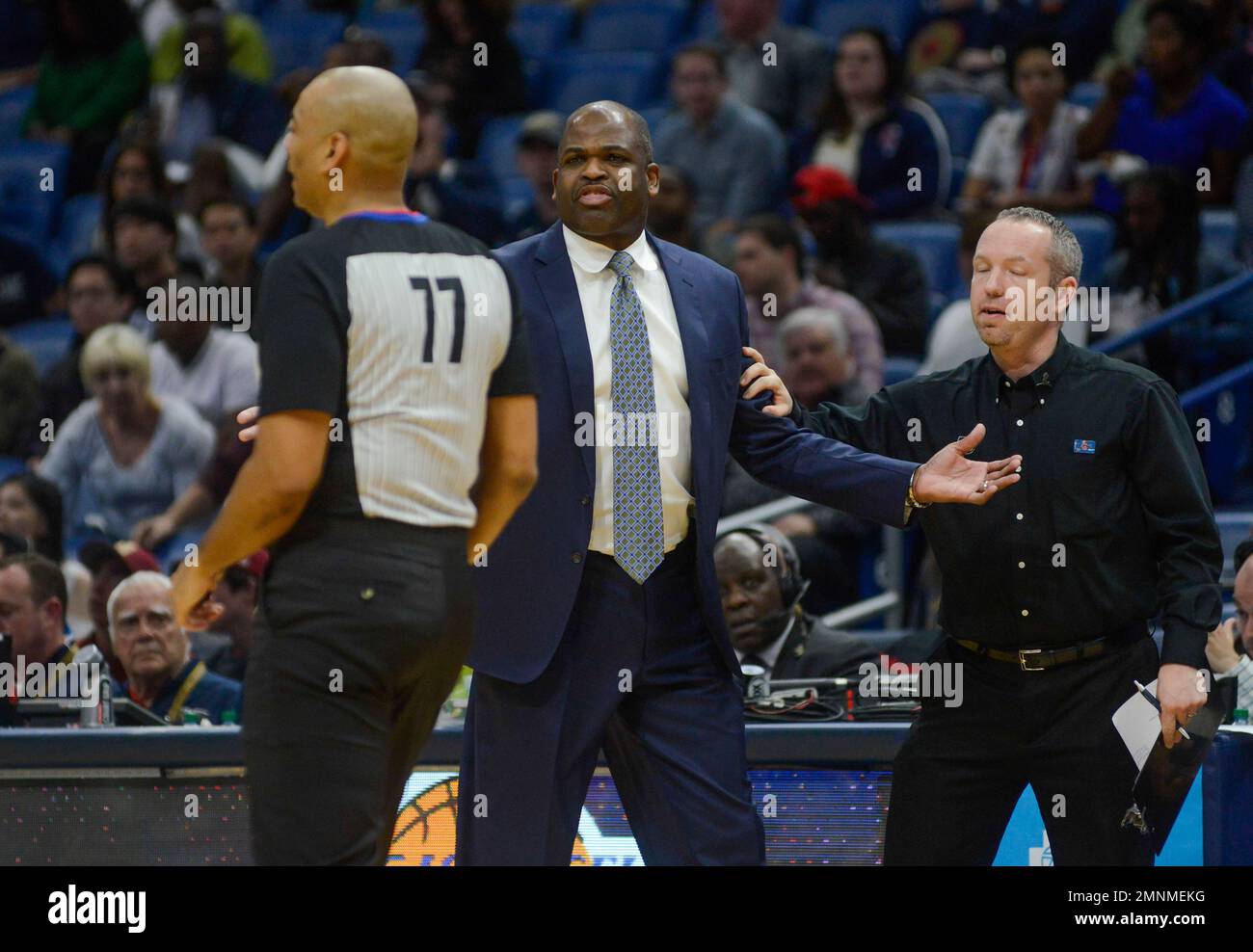 Indiana Pacers coach Nate McMillan questions officials about a call ...