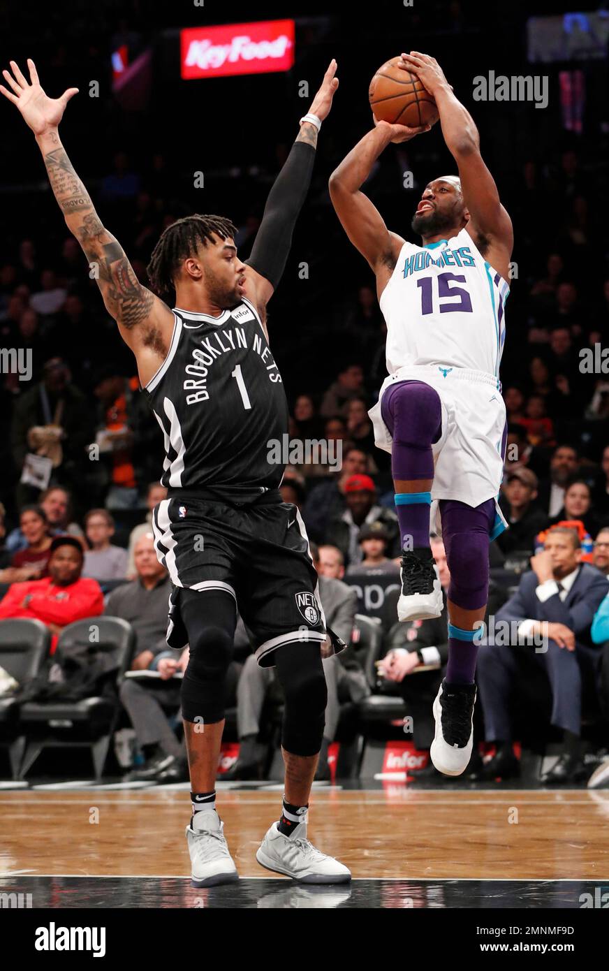 Charlotte Hornets guard Kemba Walker (15) shoots as Brooklyn Nets guard ...