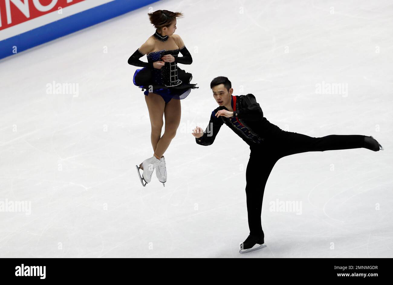 China's skaters Cheng Peng and Yang Jin perform during a pairs short ...
