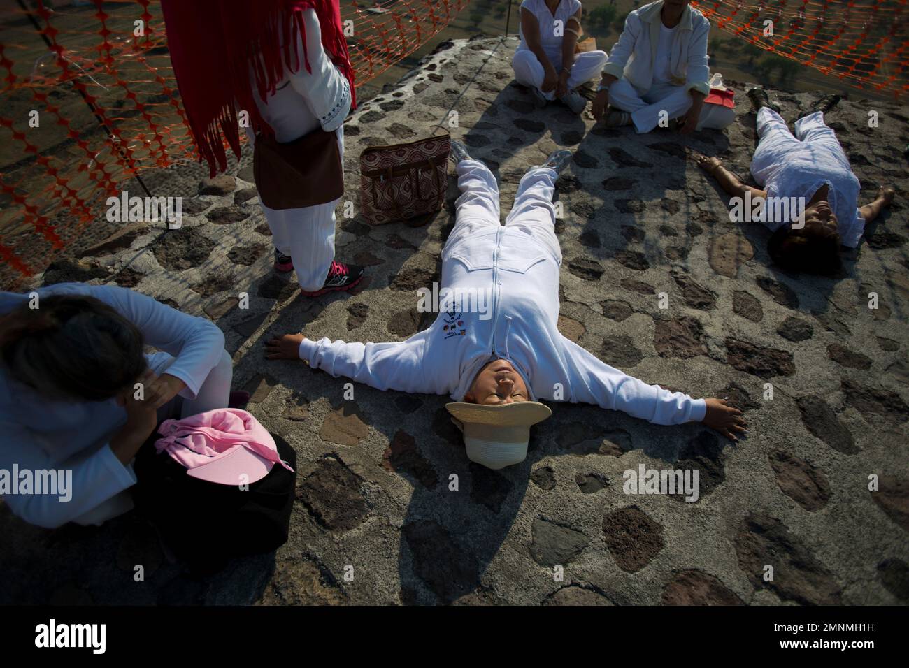 Visitors soak up the sun's energy as they celebrate the Spring equinox ...