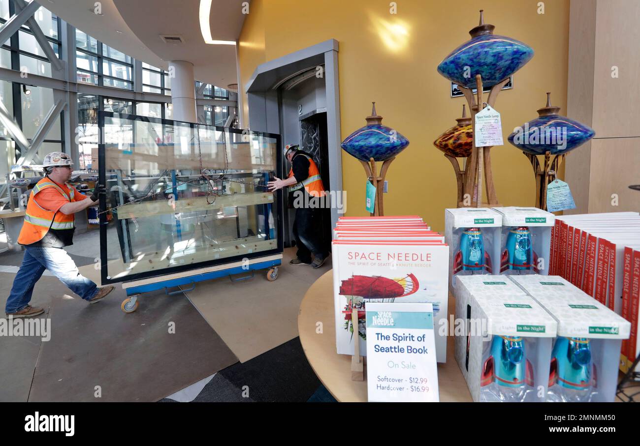 Glazers move glass panels for restaurant flooring through a Space ...