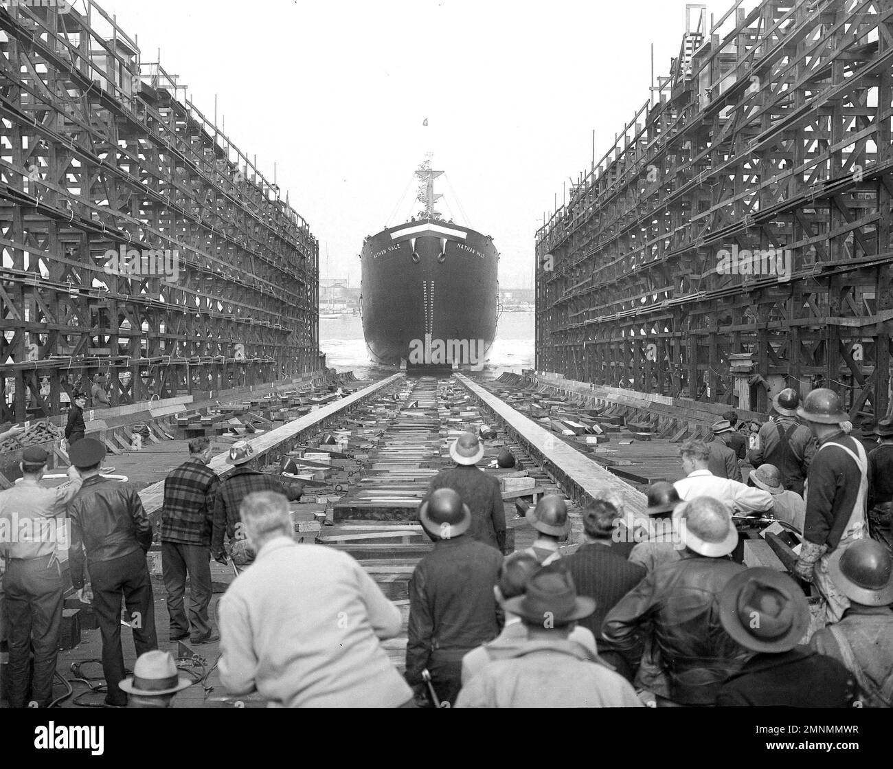Workers and onlookers watch as the liberty ship, Nathan Hale, a 10,000 ...