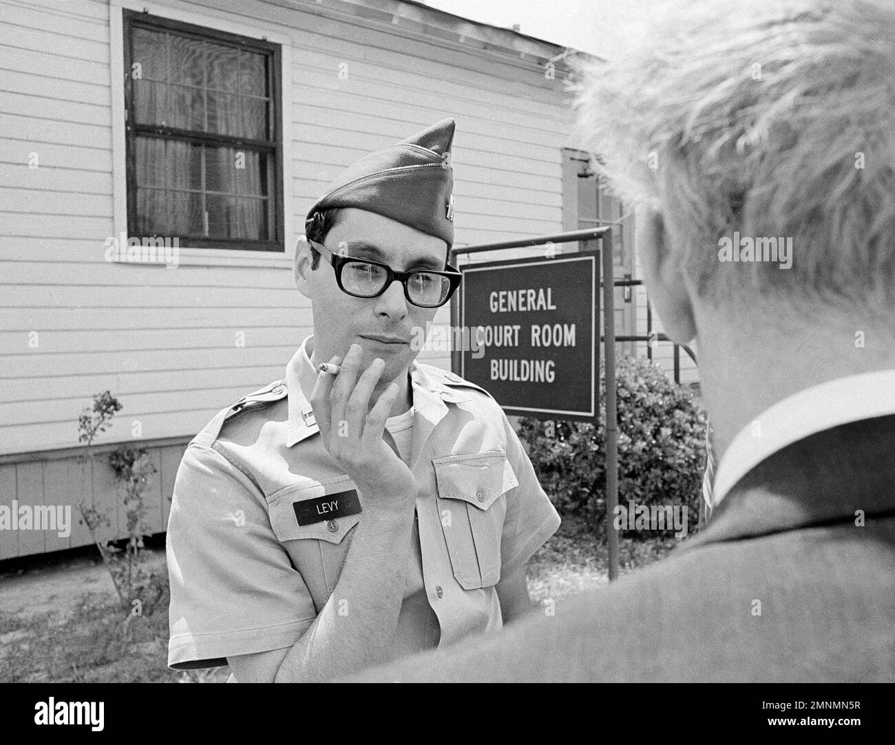 Capt. Howard Levy of Brooklyn, N.Y., puffs on a cigarette outside the ...
