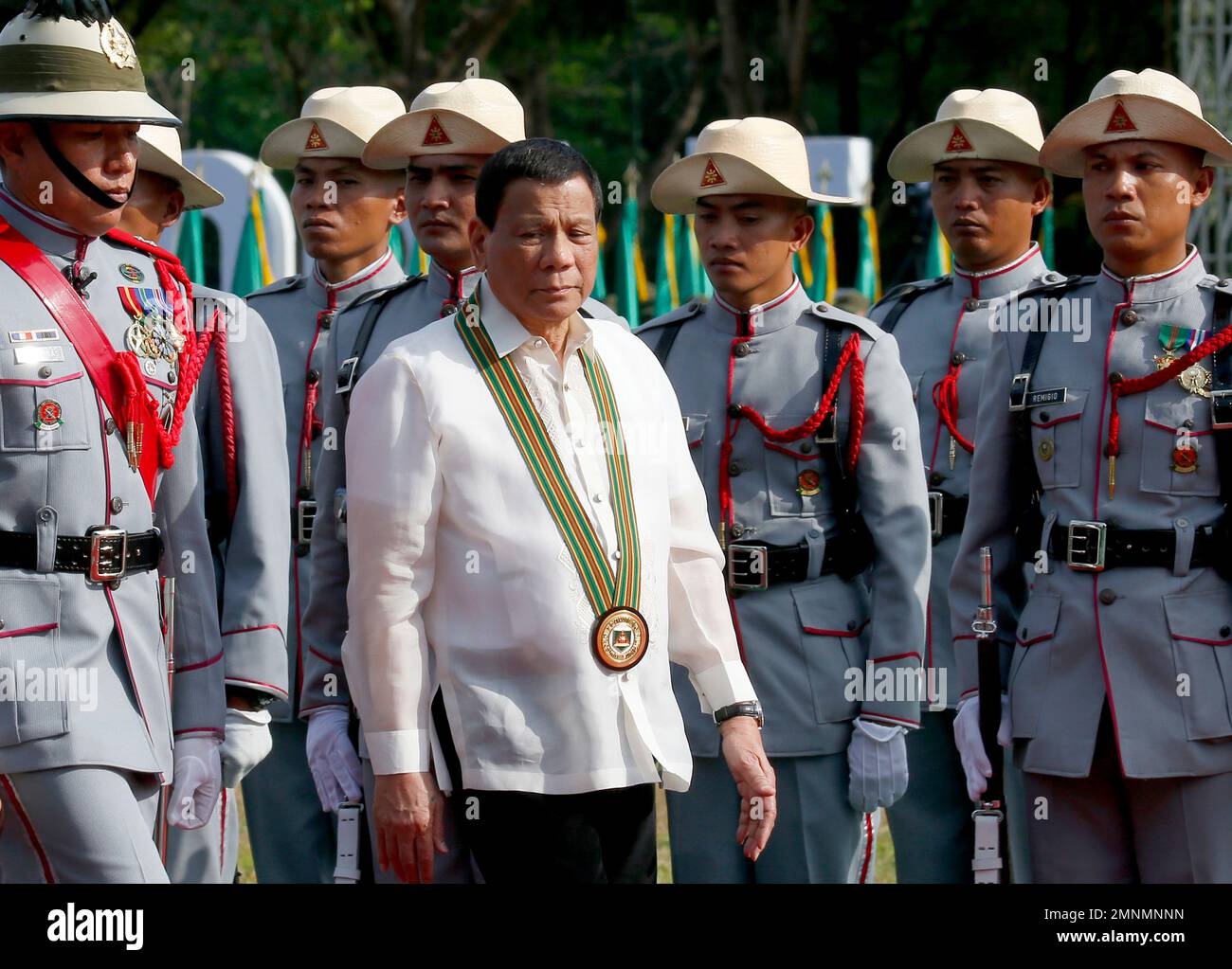 President Rodrigo Duterte reviews the troops during the 121st ...