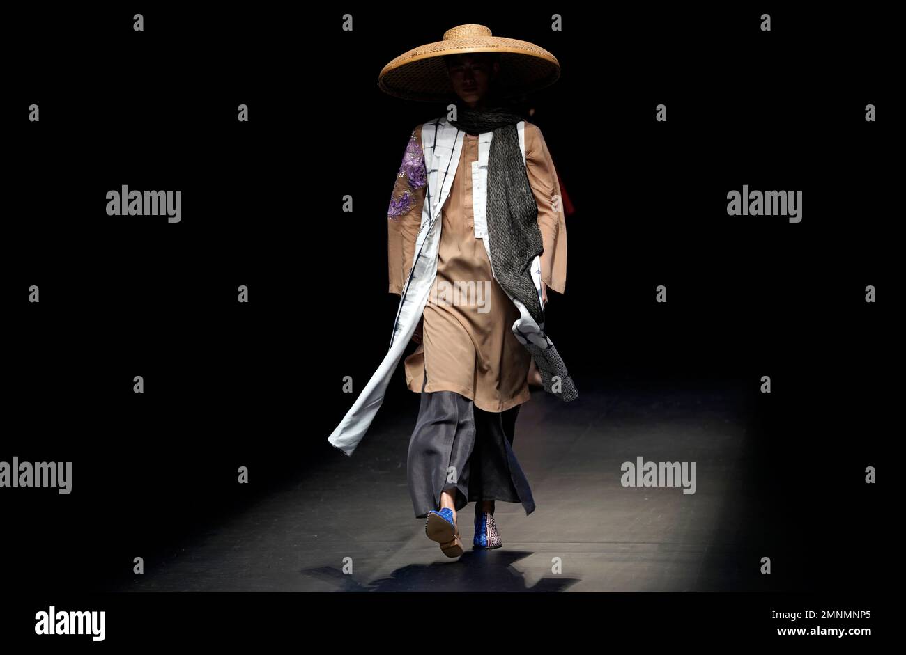 A model displays a creation by Anandia Marina Putri and Novita Yunus of ...