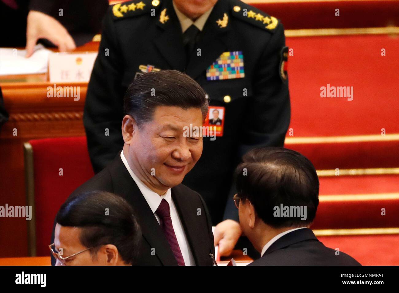 Chinese President Xi Jinping, left, shakes hands with an attendee after ...