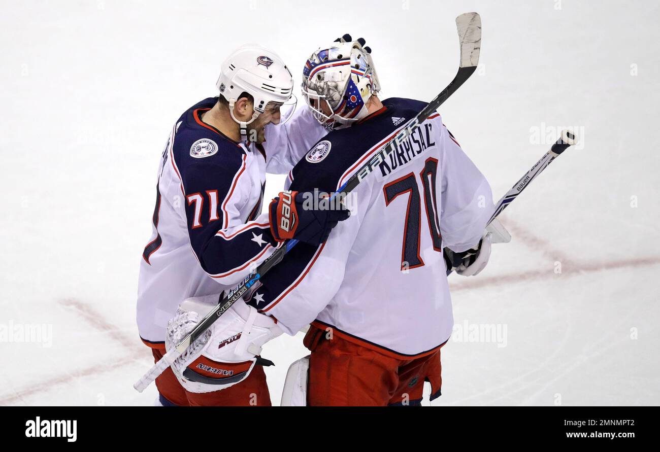 Columbus Blue Jackets left wing Nick Foligno (71) congratulates ...