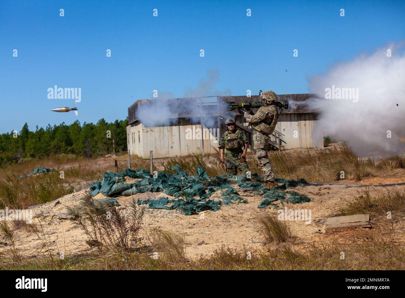 A competitor representing the U.S. Army Medical Command fires a M136E1 ...