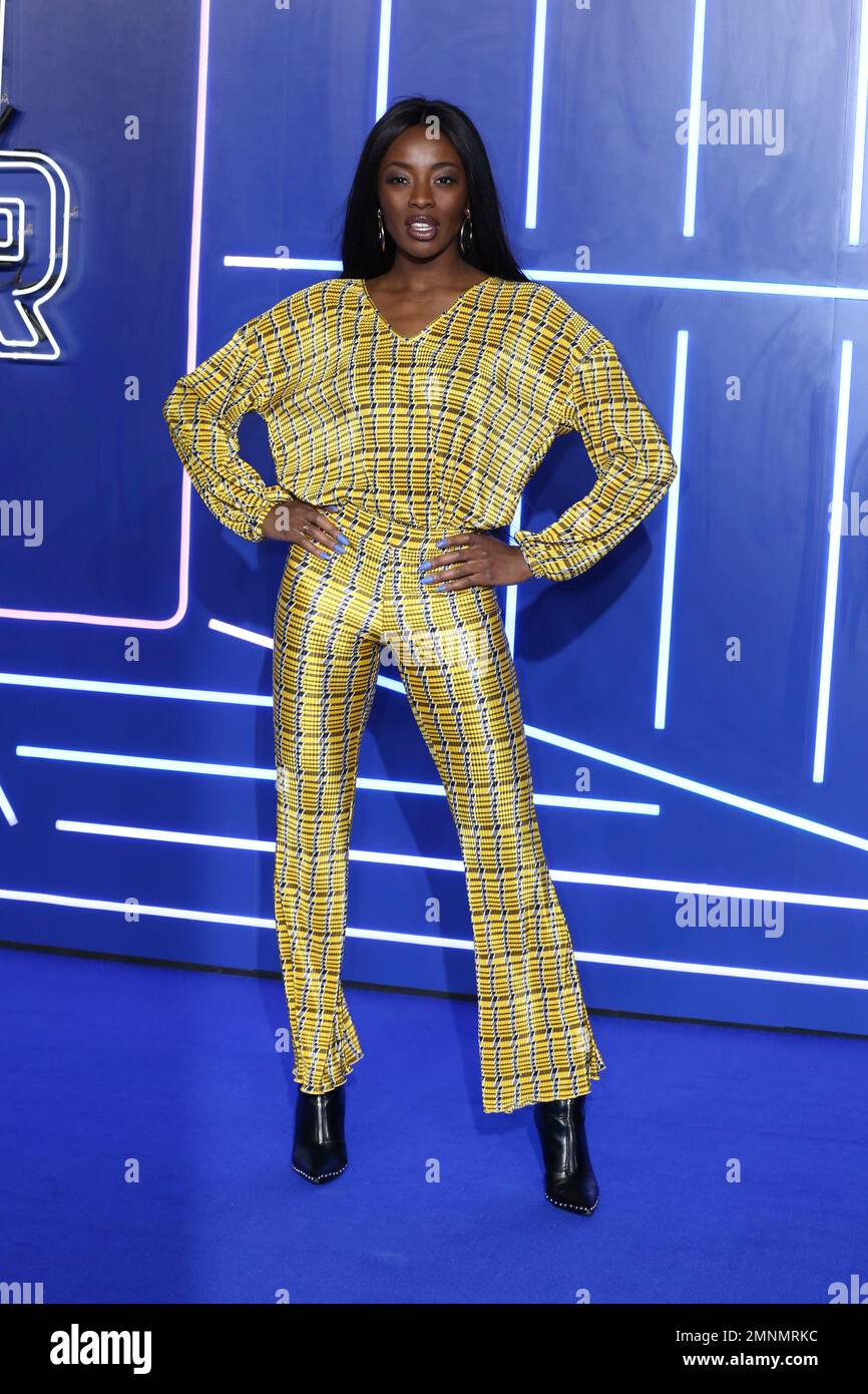 Television Presenter Aj Odudu poses for photographers on arrival at the ...