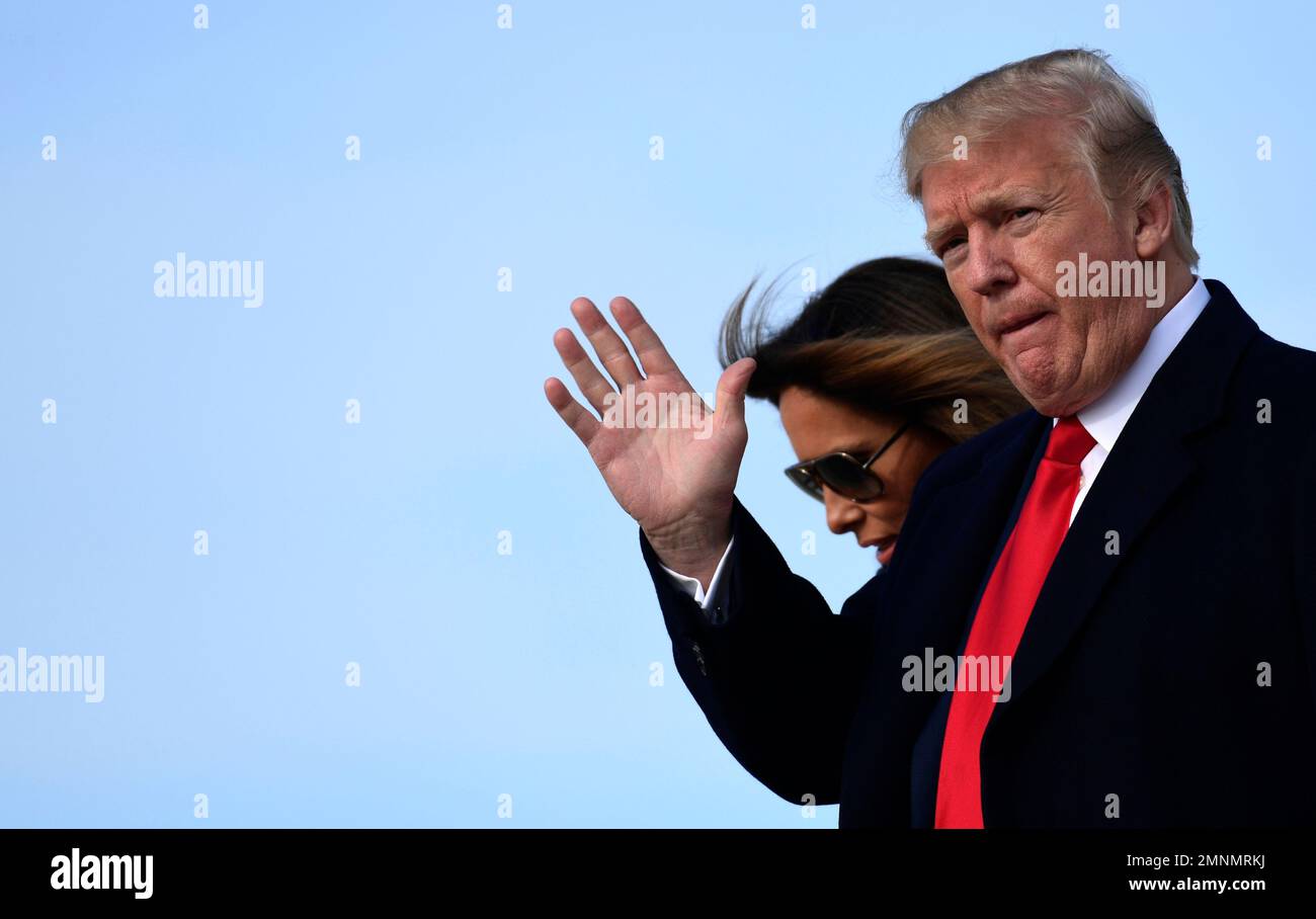 President Donald Trump and first lady Melania Trump walks down the ...