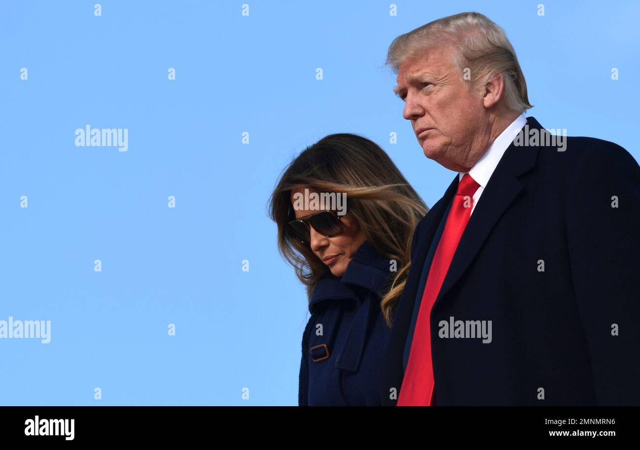 President Donald Trump and first lady Melania Trump walks down the ...