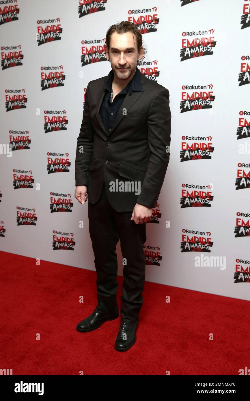 Actor Joseph Mawle poses for photographers on arrival at the Empire ...