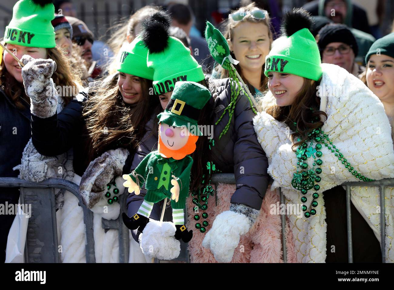 Spectators stay warm with hats and blankets while watching the annual ...