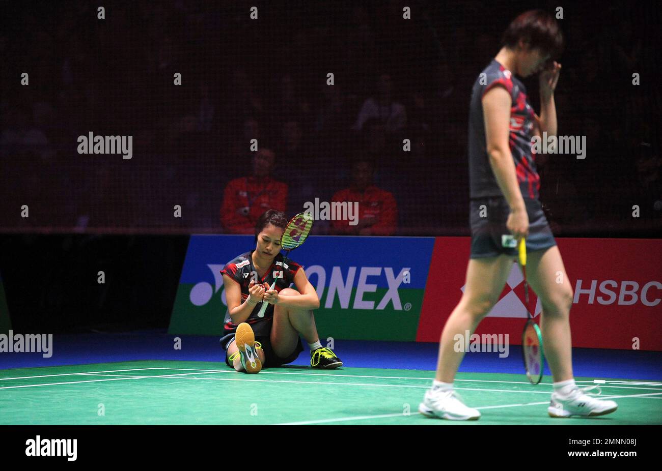 Japan's Yuki Fukushima and Sayaka Hirota, right, react after loosing a point to Denmark's ...