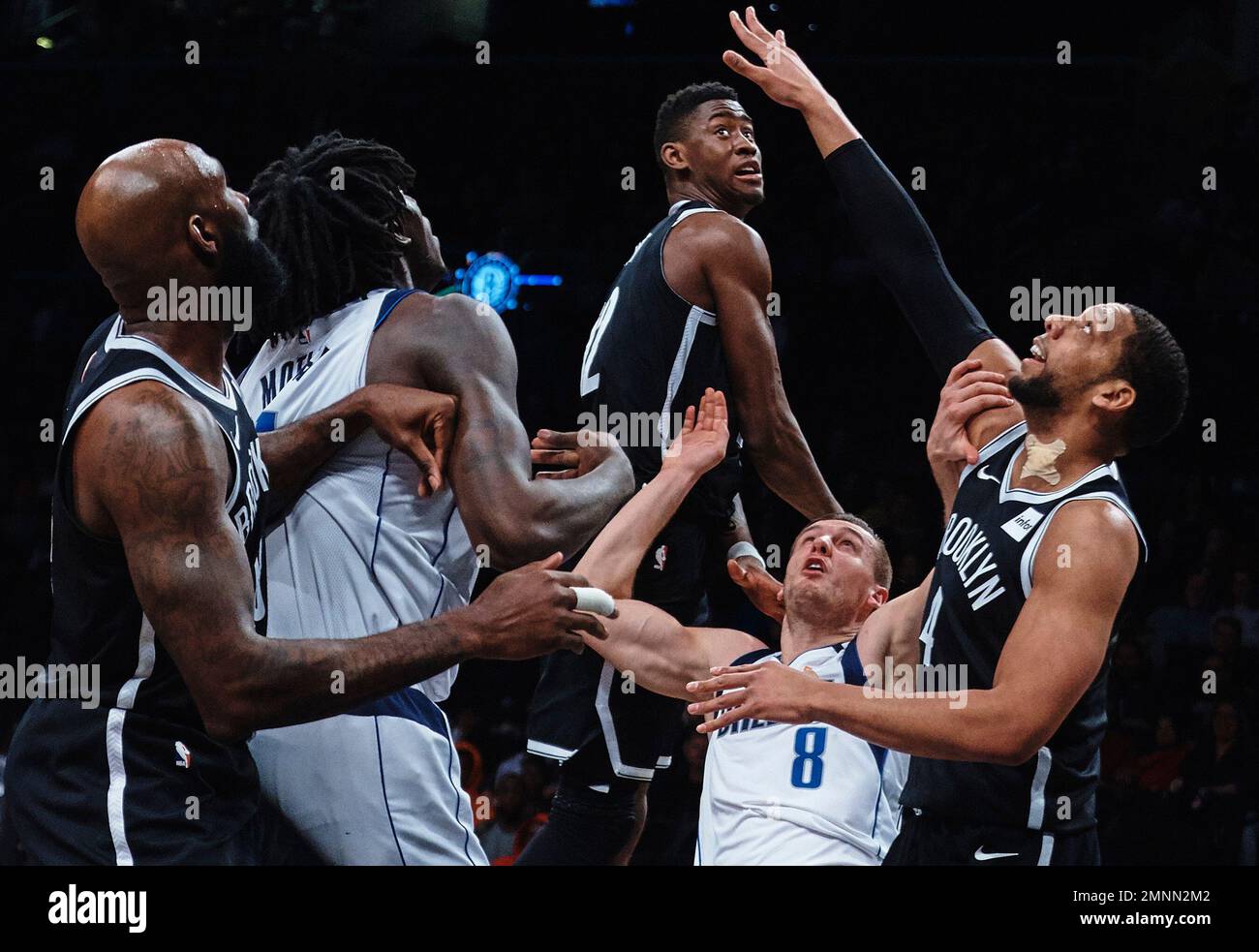 Dallas Mavericks' Kyle Collinsworth (8) fights for a loose ball with ...