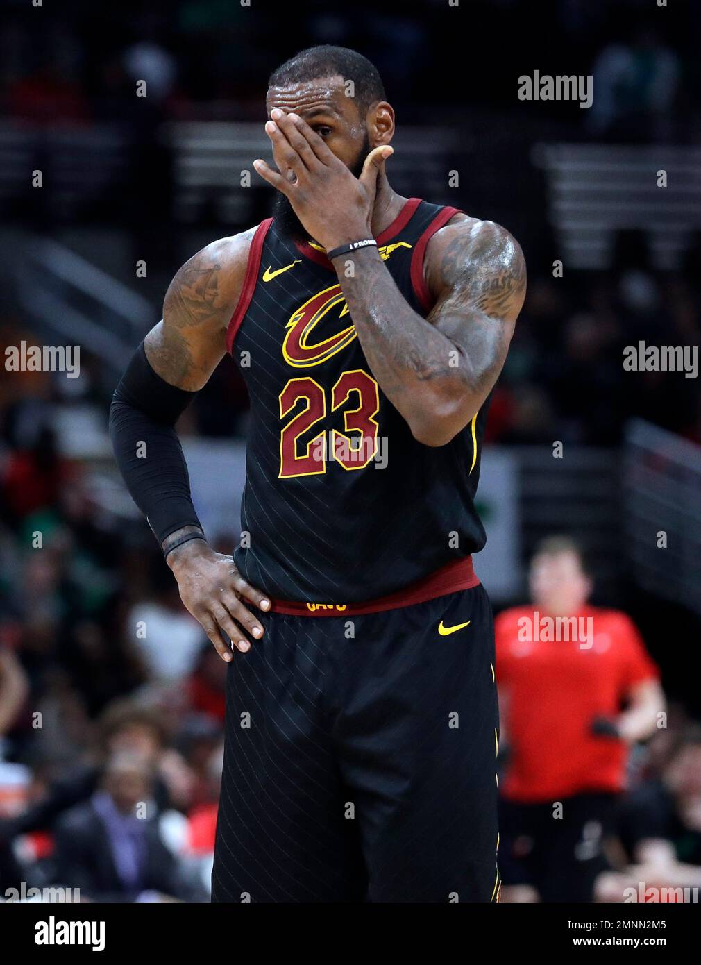 Cleveland Cavaliers forward LeBron James wipes his face during the ...