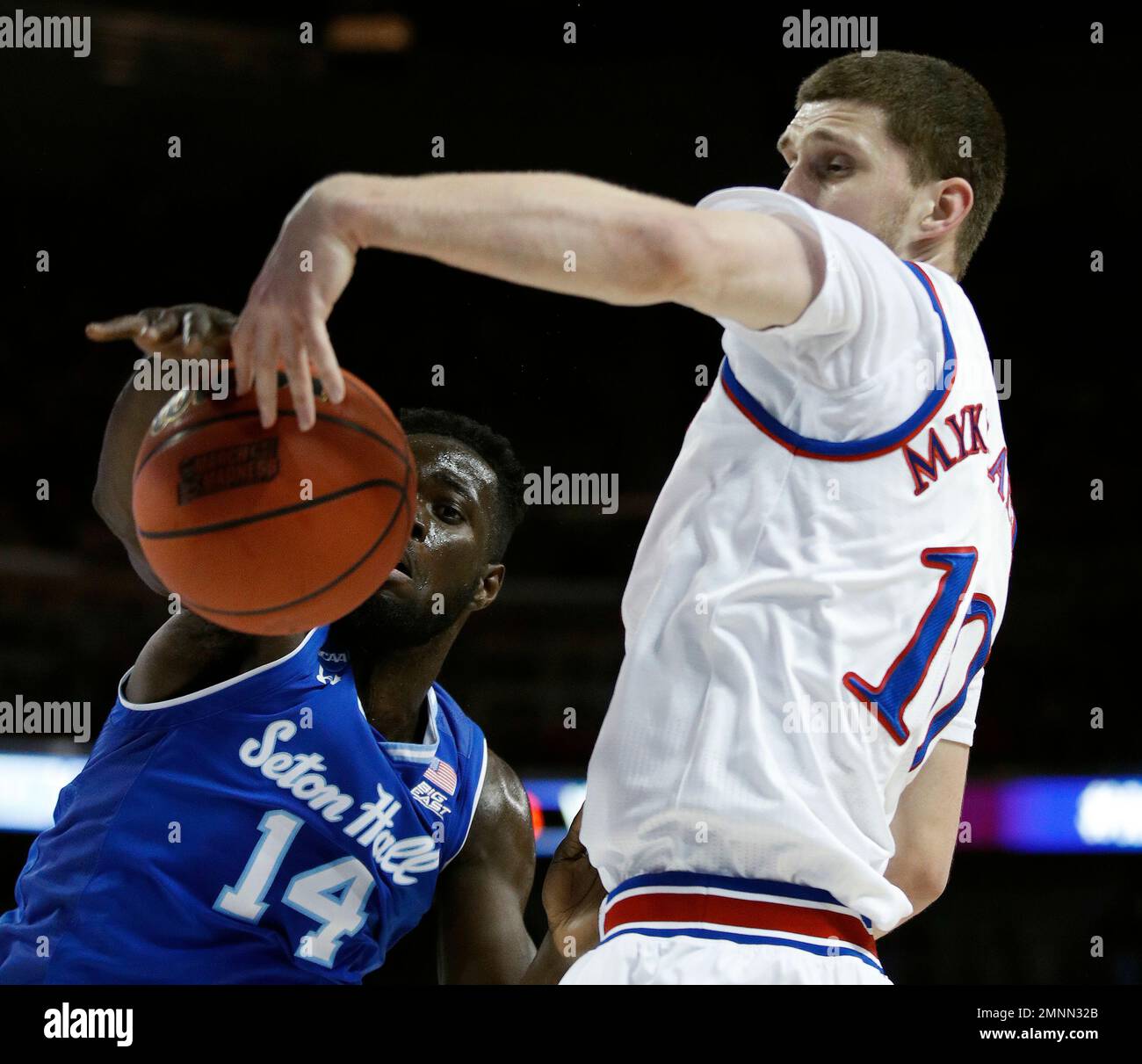 Seton Hall forward Ismael Sanogo (14) and Kansas guard Chris Teahan (12 ...