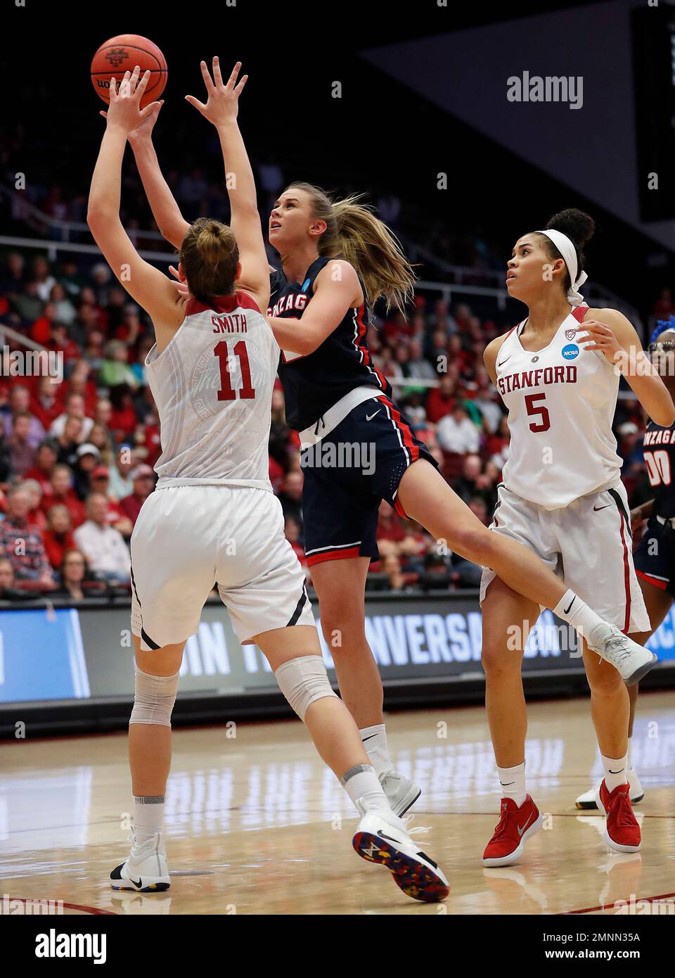 Gonzaga forward Jill Barta, center, takes a shot over Stanford forward ...