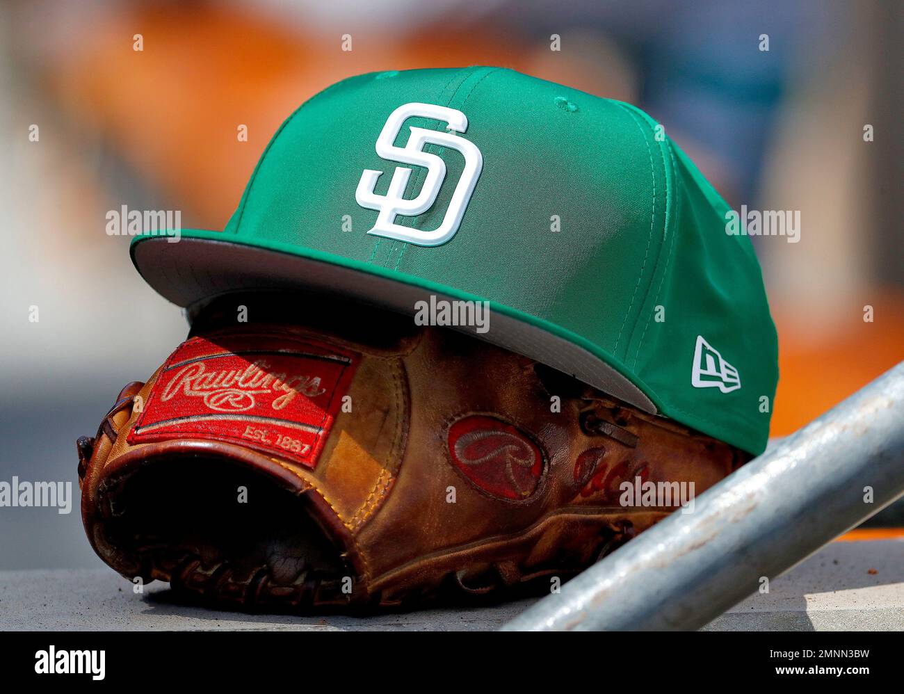 A green San Diego Padres cap, in celebration of St. Patrick' Day, sits ...