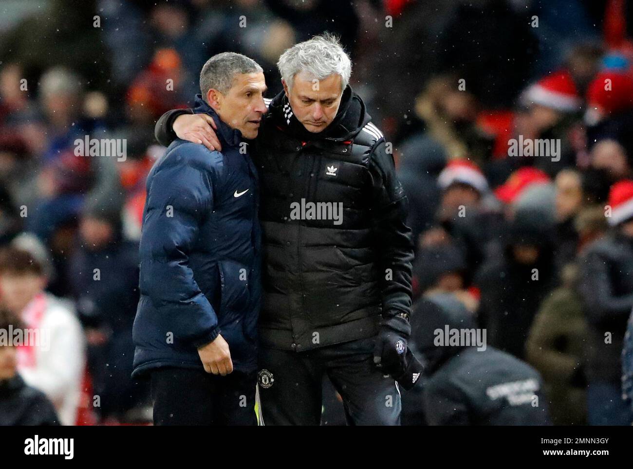 Manchester United head coach Jose Mourinho, right, embraces Brighton ...