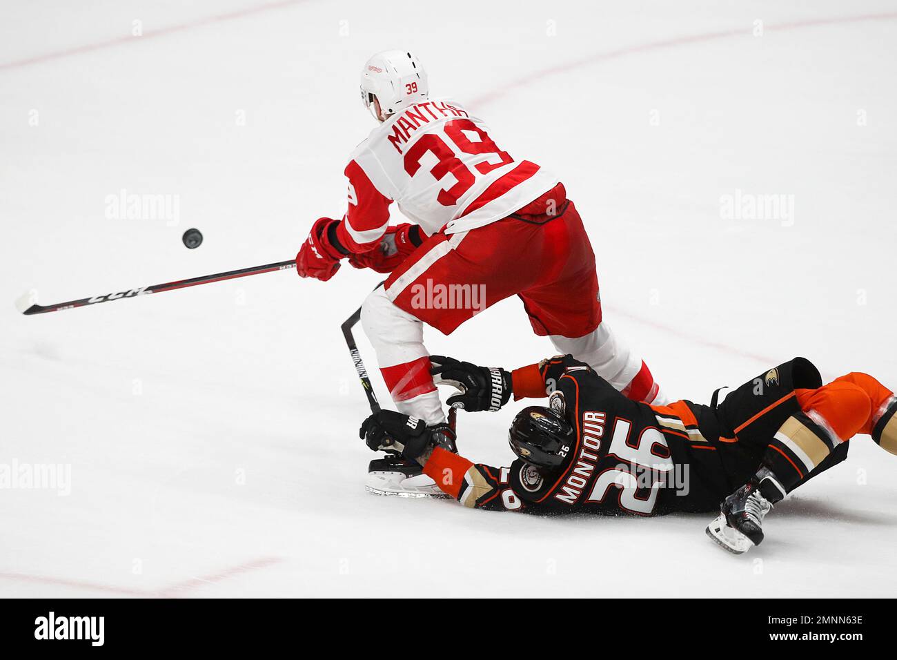 Detroit Red Wings' Anthony Mantha, top, moves the puck past Anaheim ...
