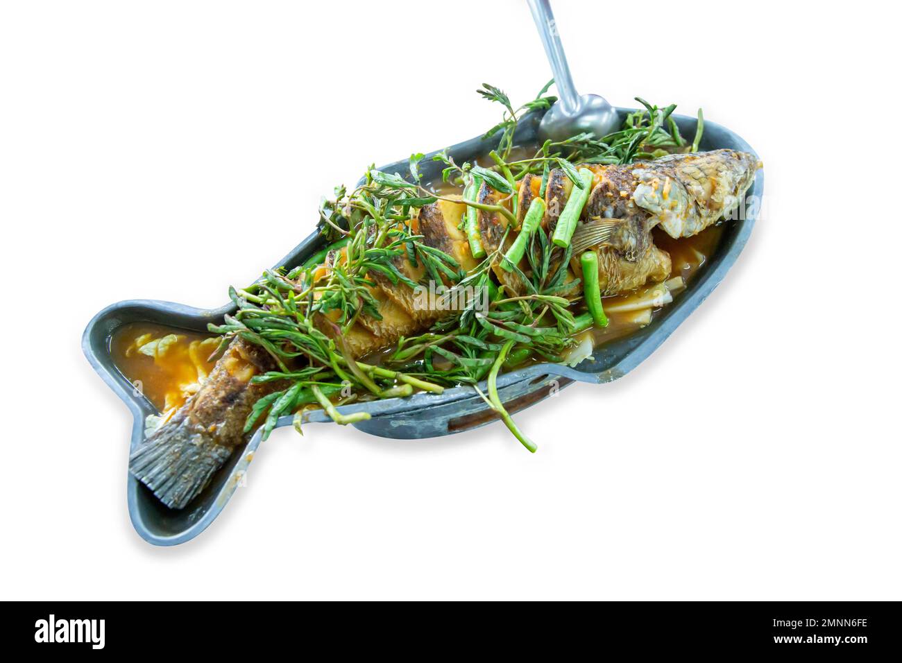 Die cut of Deep fried snakehead Fish in Spicy Sour Soup on white ...