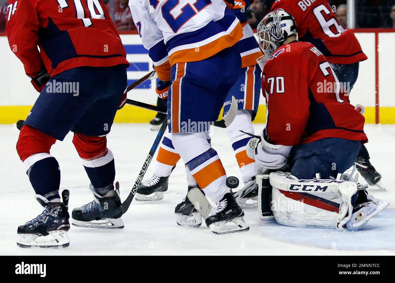 Washington Capitals goaltender Braden Holtby (70) deflects the puck in ...