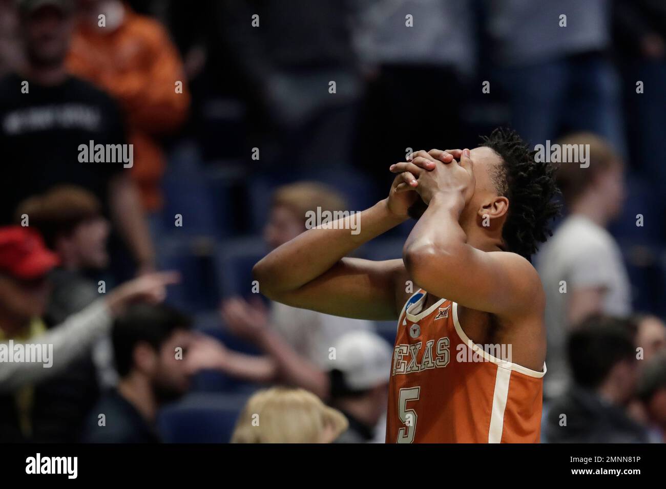 Texas forward Royce Hamm Jr. (5) reacts after losing in overtime of a ...