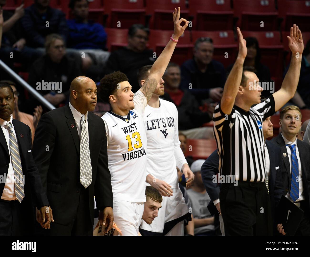 West Virginia forward Teddy Allen (13) reacts on the bench during the ...