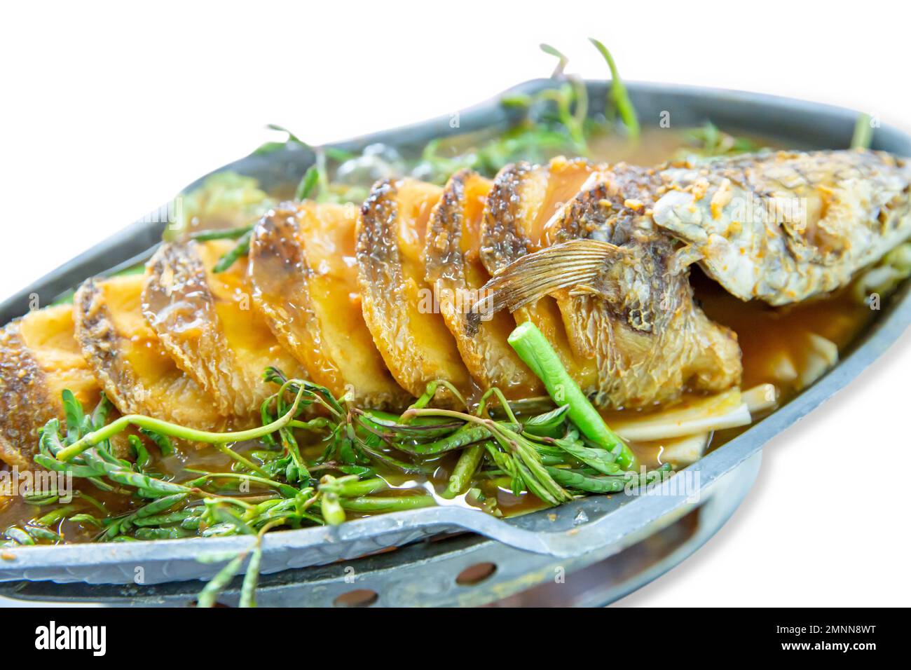 Die cut of Deep fried snakehead Fish in Spicy Sour Soup on white ...