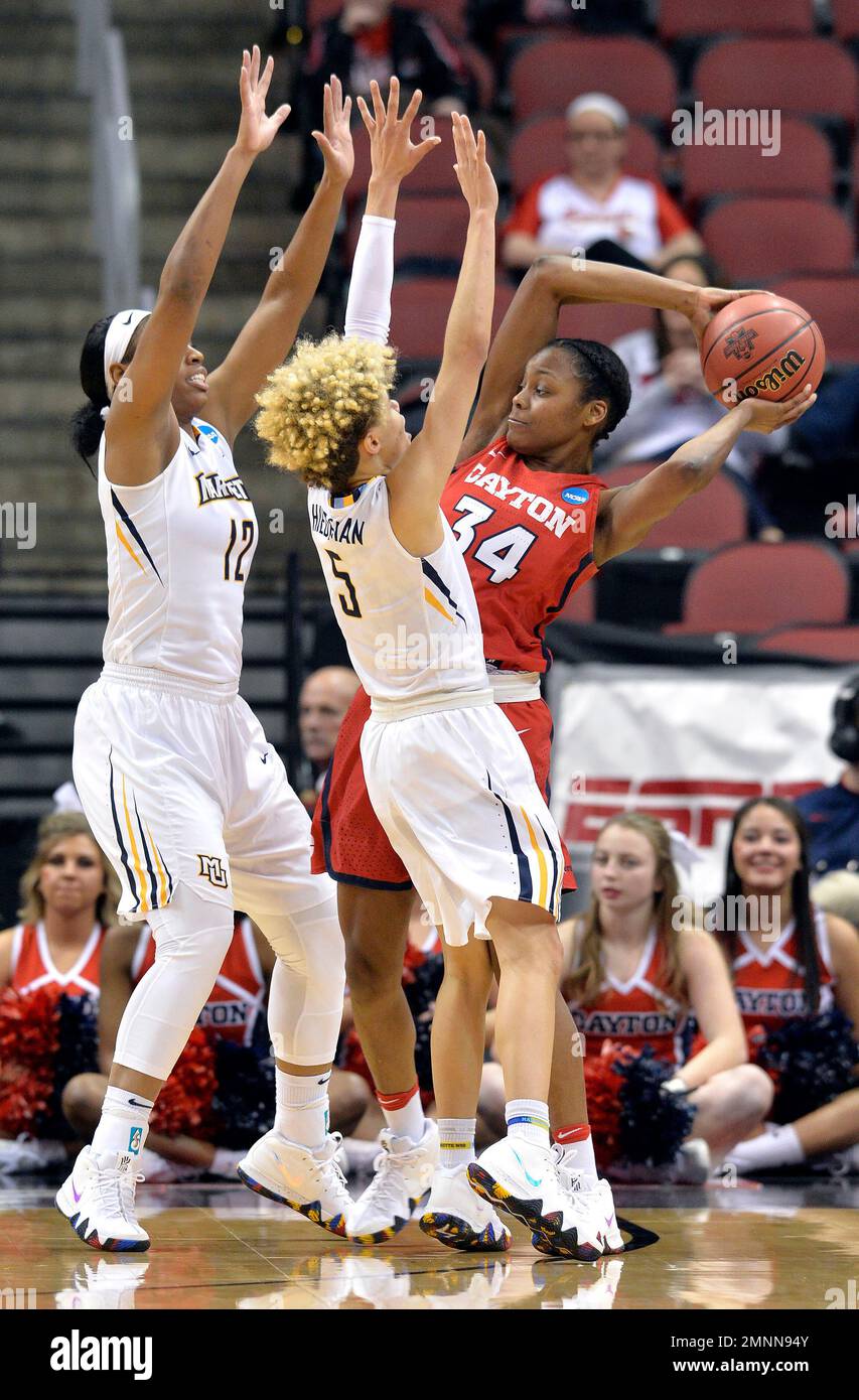 Dayton guard Javonna Layfield (34) looks for help from the defense of ...