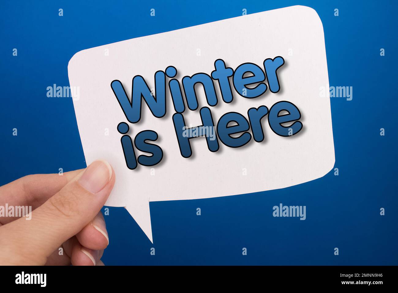 Speech bubble in front of colored background with Winter is Here text ...