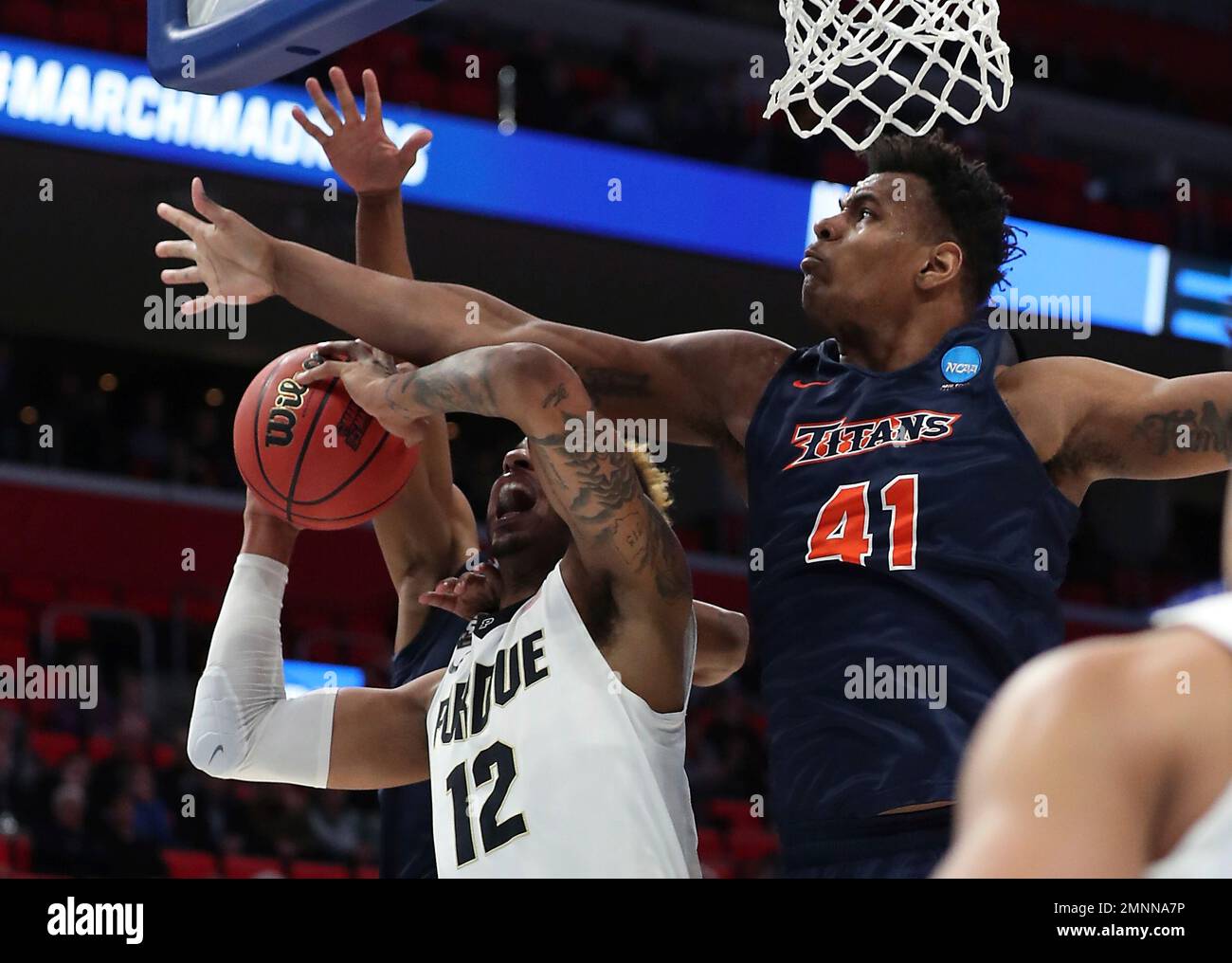 Cal State Fullerton forward Josh Pitts (41) attempts to block a shot by ...