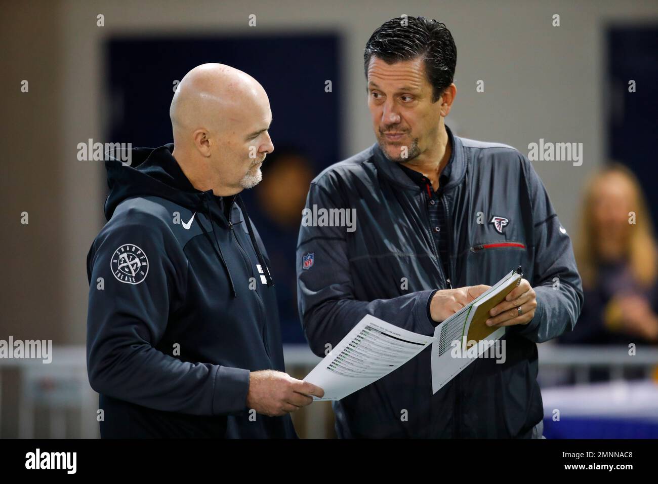 Atlanta Falcons NFL football team head coach Dan Quinn, left, speaks ...