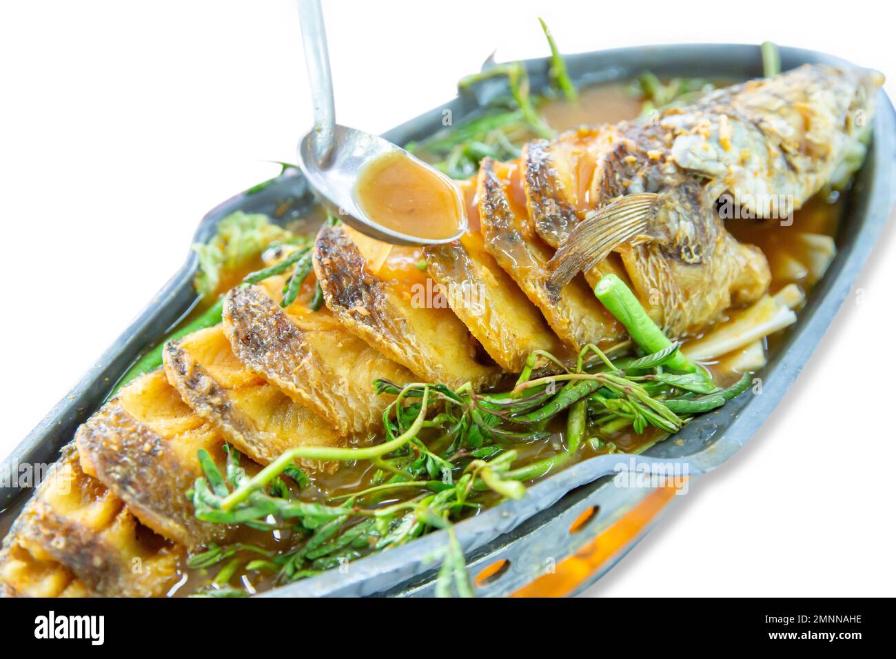 Die cut of Deep fried snakehead Fish in Spicy Sour Soup on white ...