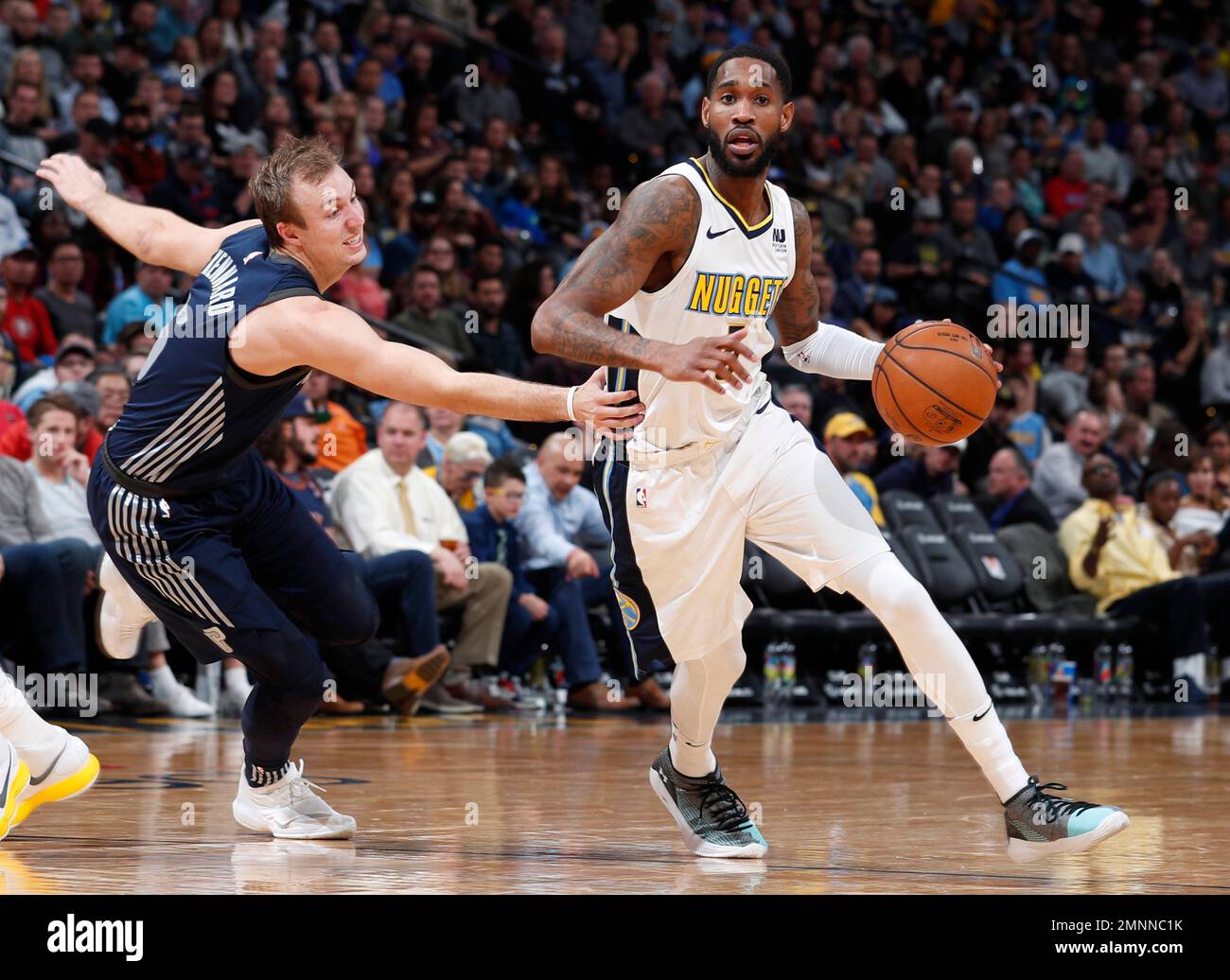 Denver Nuggets forward Will Barton, right, drives the lane past Detroit ...
