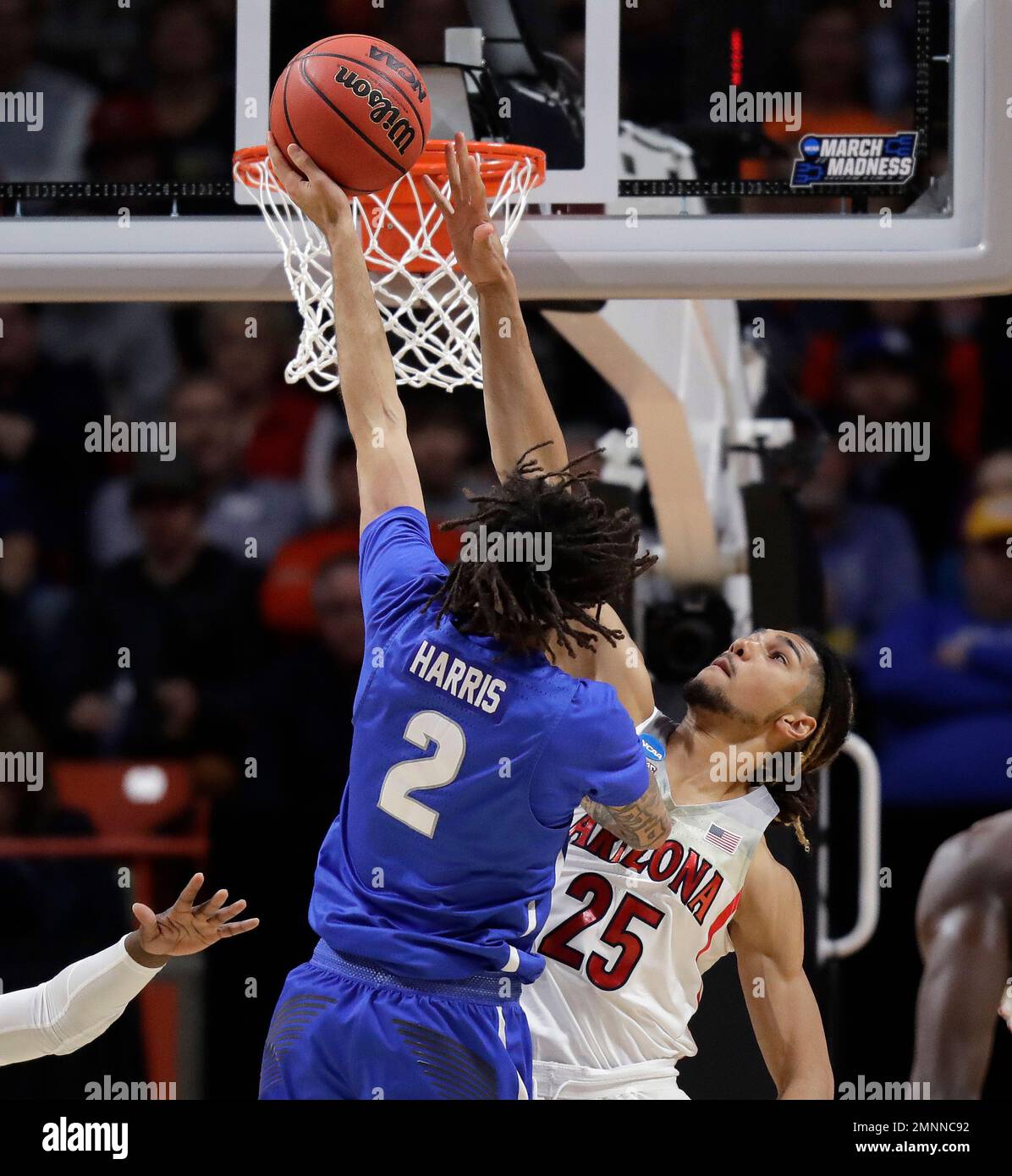 Buffalo guard Jeremy Harris (2) shoots against Arizona forward Keanu ...