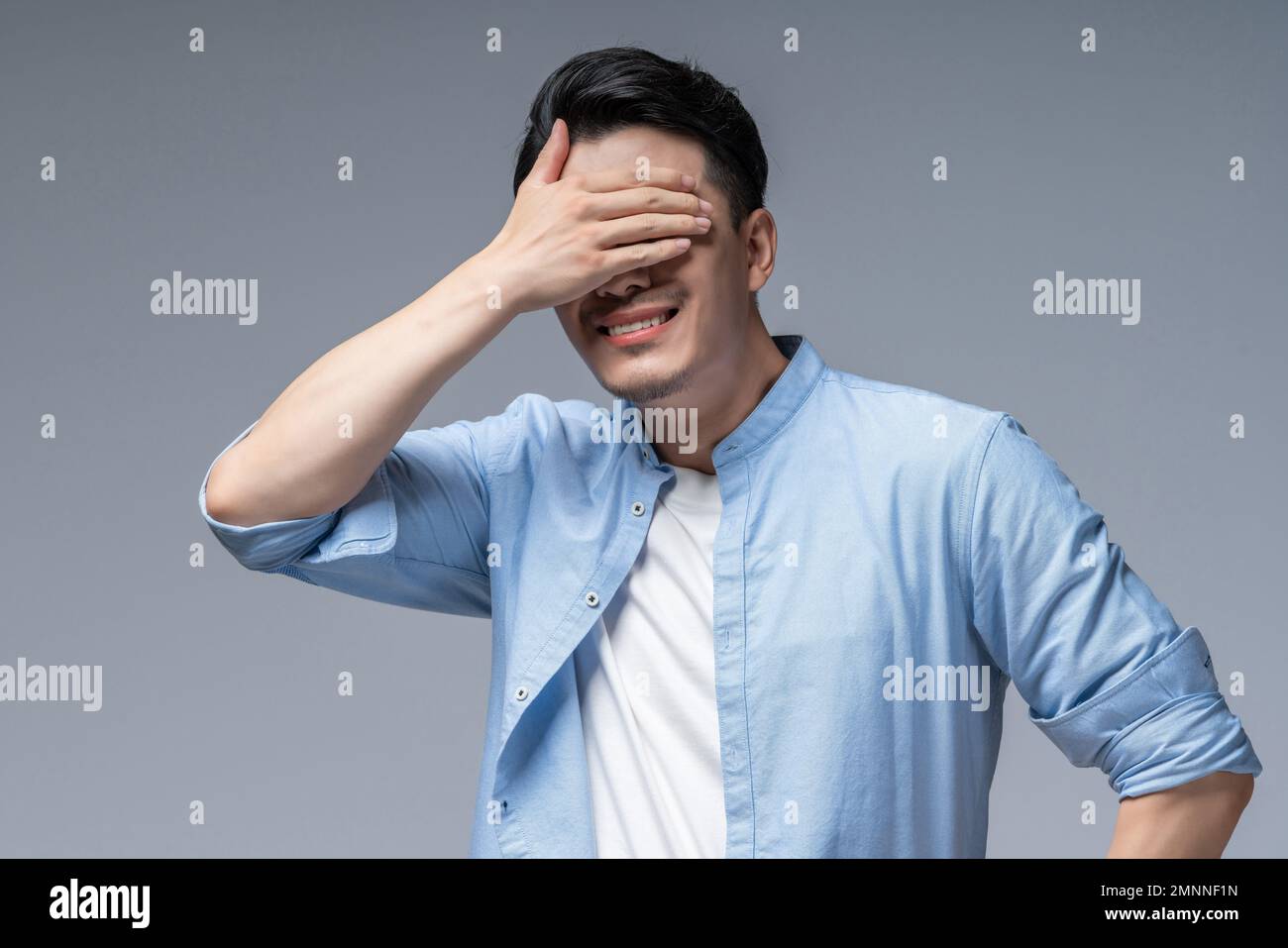 A shy young man Stock Photo - Alamy