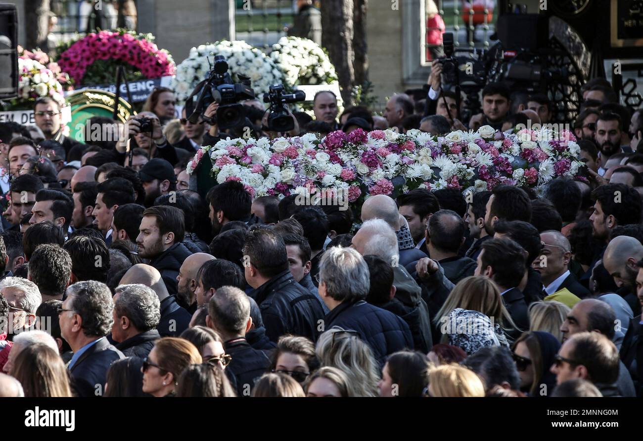 People carry flower-covered coffin of Mina Basaran during funeral ...