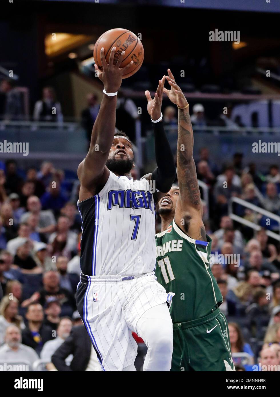 Orlando Magic's Shelvin Mack (7) shoots in front of Milwaukee Bucks ...