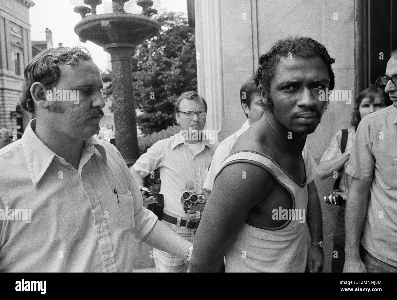 FILE- In this Sept. 1, 1973 file photo, Herman Bell, right, glares at ...