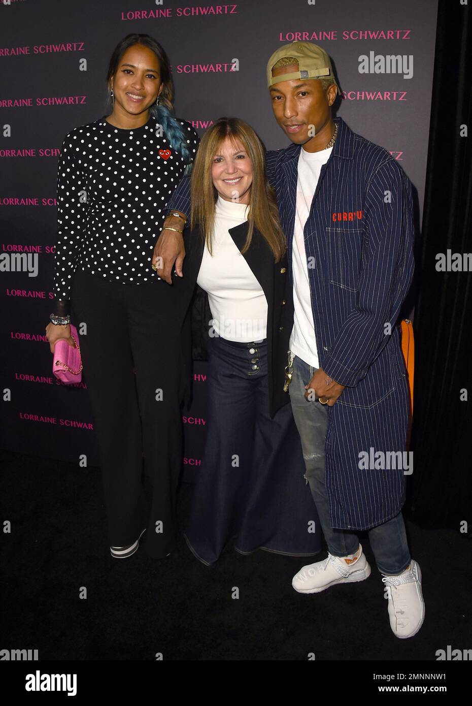 Helen Lasichanh, from left, Shelli Azoff and Pharrell Williams arrive ...