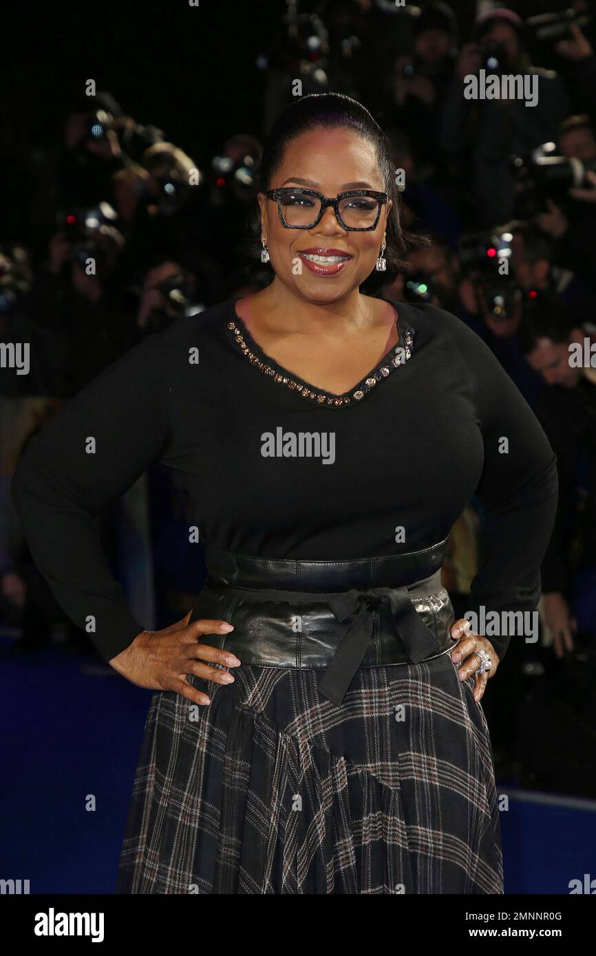 Actress Oprah Winfrey poses for photographers upon arrival at the ...