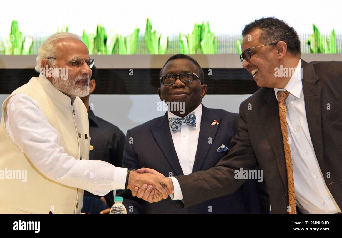 Indian Prime Minister Narendra Modi, left, shakes hands with World ...